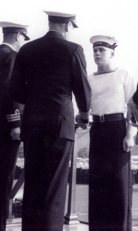 Photograph of Boy Dennis Snape being presented witha swimming trophy by ...