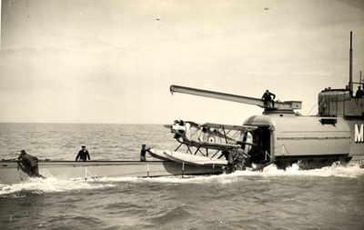Photograph of the seaplane emerging from the hanger aboard HM Submarine ...