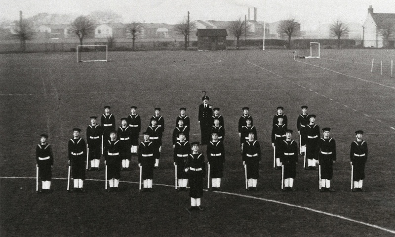 Copy photograph of Rodney Division, 16 Mess Guard at attention, 1953 ...