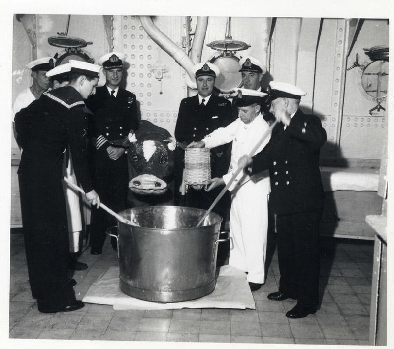 A photograph of Captain Pond stirring the Christmas pudding on HMS ...