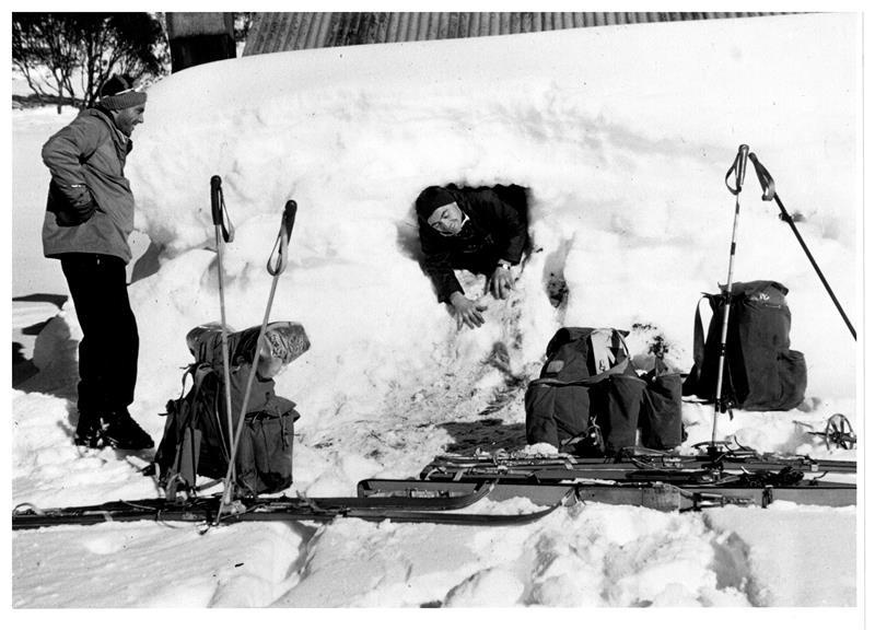 Mark Mealey and Rymill Abel climbing out of Whites River hut during a ...