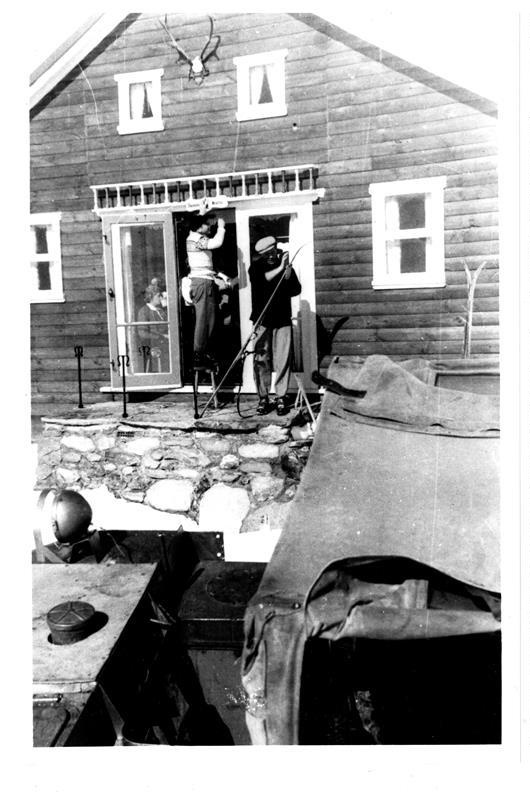 Charles Anton and Tony Sponar at Kunama Hut 1954. Weasel vehicle ...