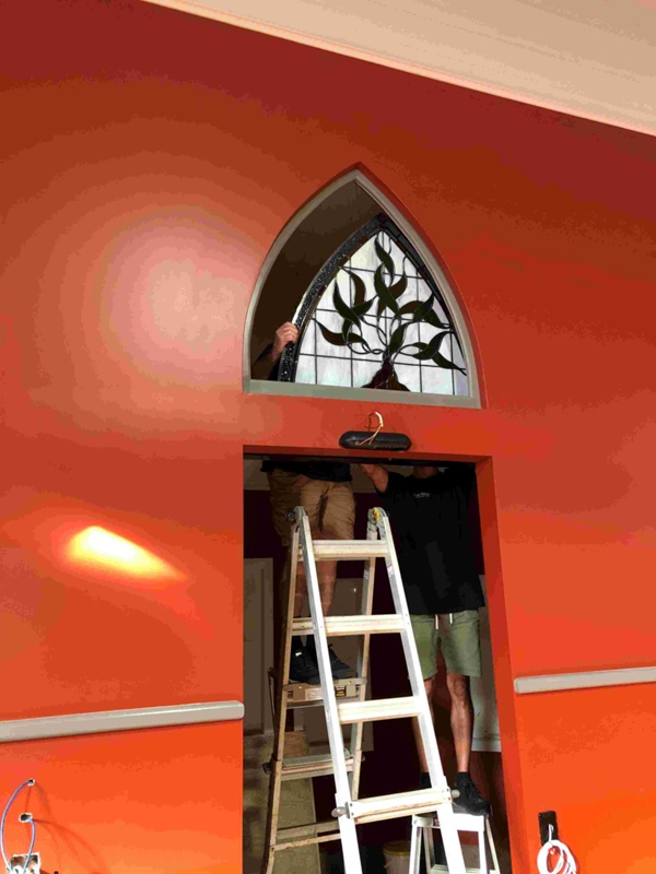 Installation of stained glass arched window; Eumundi Museum; 06/04/2022 ...