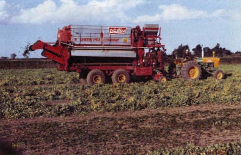 Early harvesters towed behind a tractor ex Geoff Heslop & Watties; EHS ...