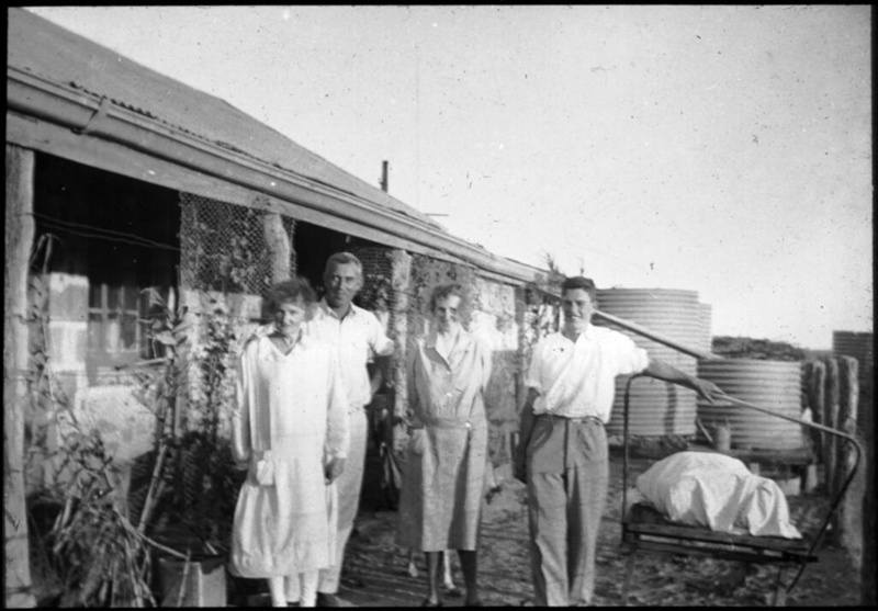 Group of unidentified people standing in front of Birdsville hospital ...