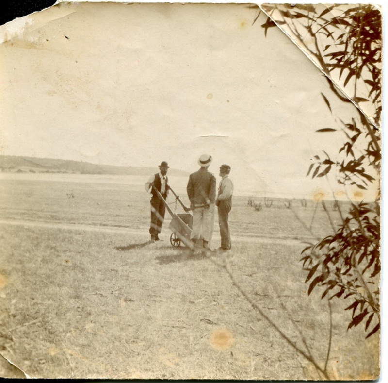 John Buick on Right, with two others on beach in front of his cottage ...