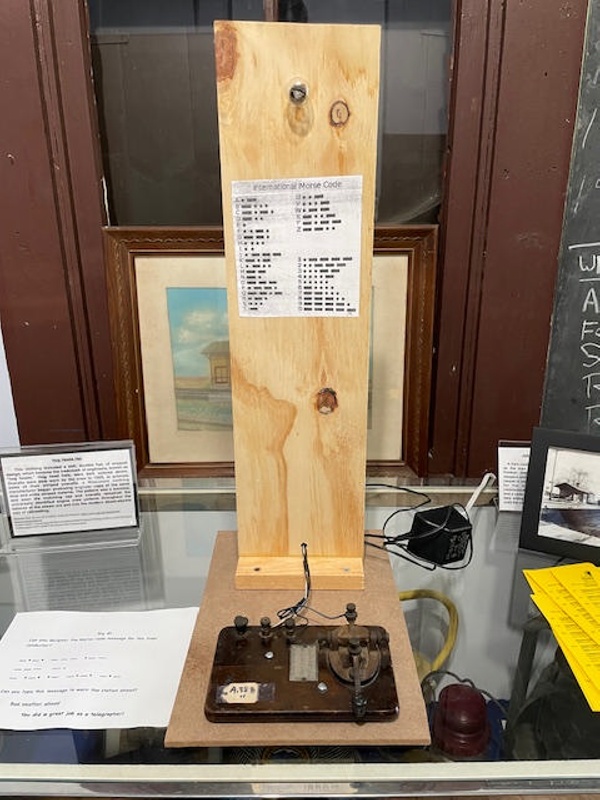 Three telegraph instruments mounted on a wood base measuring 13 1/2 x ...