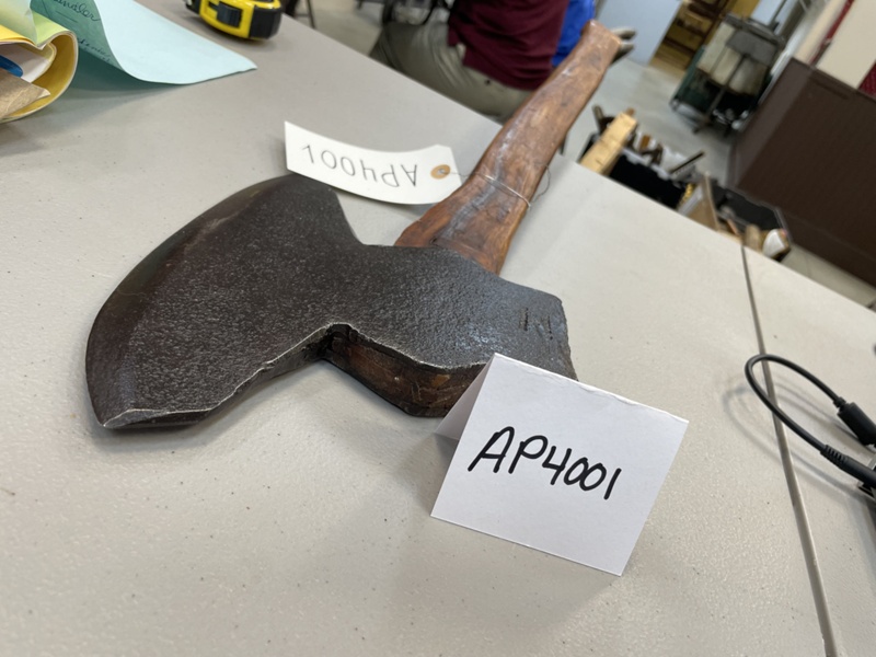 Hew axe; handmade; metal axe head; wooden handle; letters on the axe ...